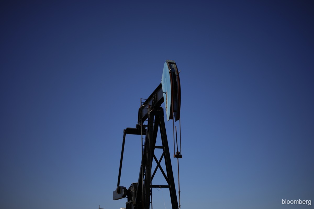 Oil heads for third monthly decline as strong dollar, ample supply weigh