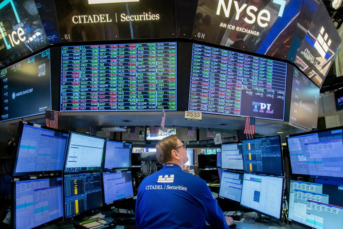 Nasdaq 100 hits record as yields fall on Powell's comments