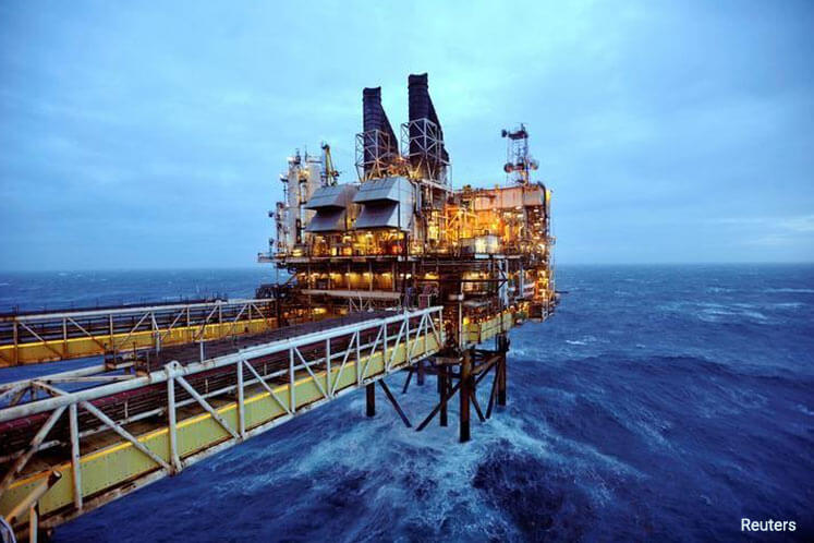 Oil rises in late trade, still down on the week as glut weighs