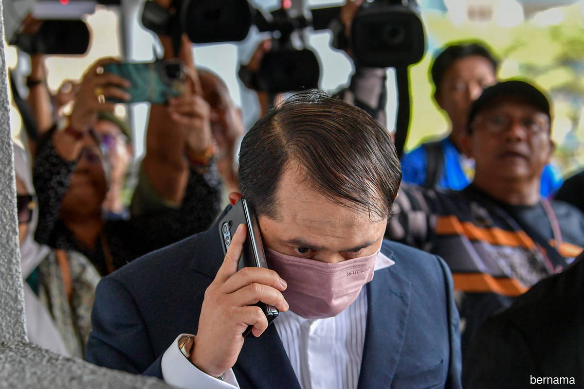 Hamzah Zainudin's former political secretary charged with graft