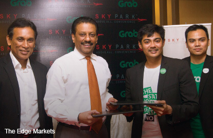 Grab inks first airport tie-up in M’sia, unveils 6-seater GrabCar