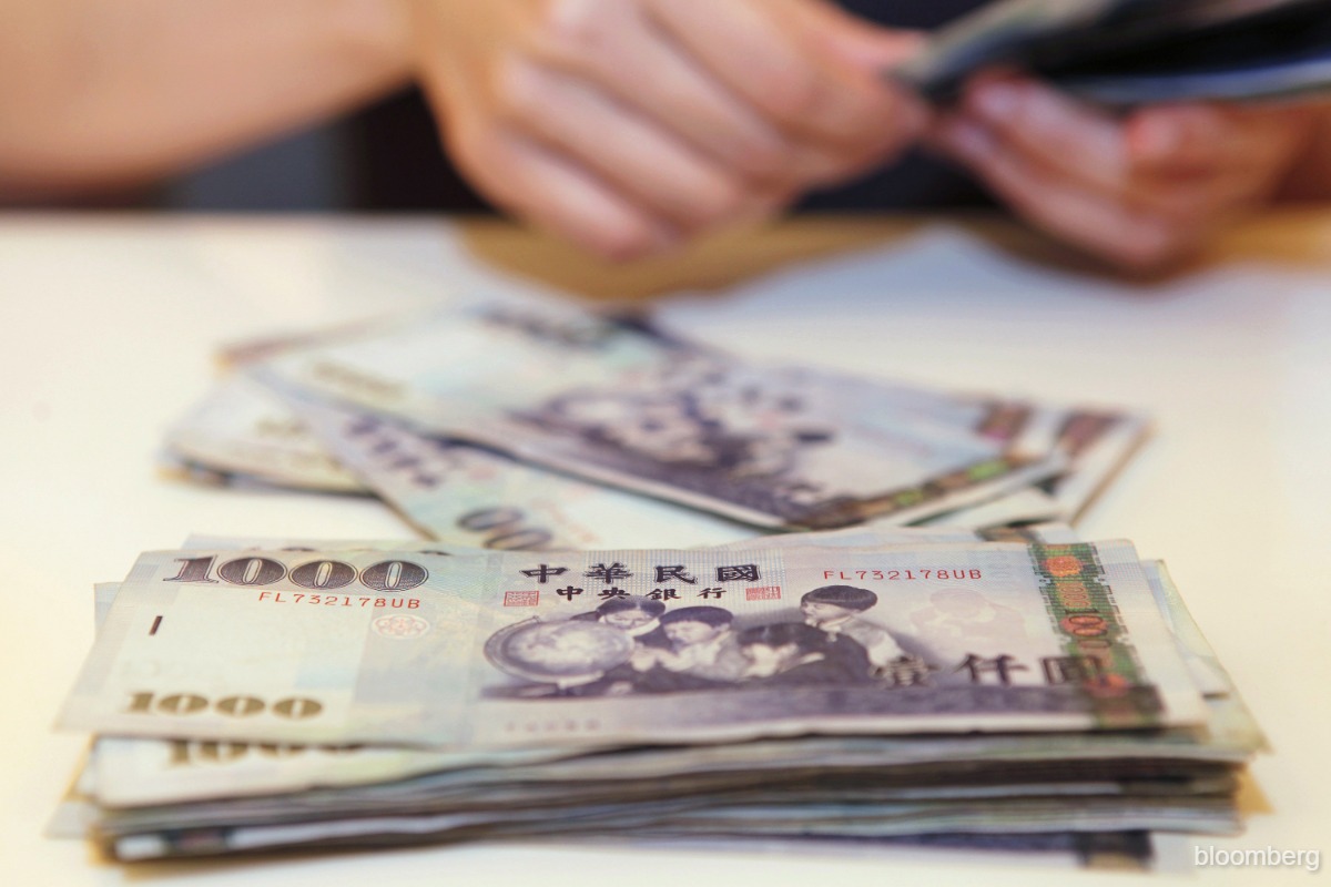 Taiwan’s central bank says it let currency soar to reset market