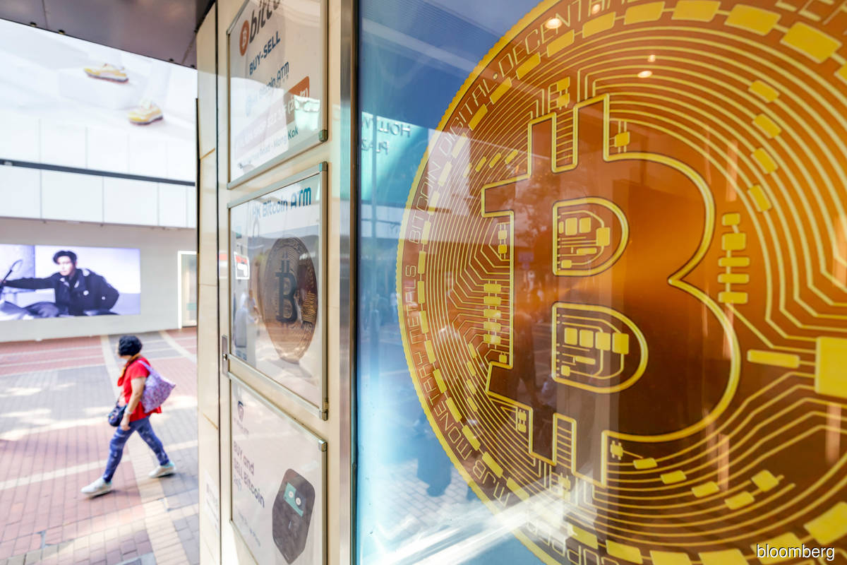 Bitcoin touches record as investors snap up riskier assets