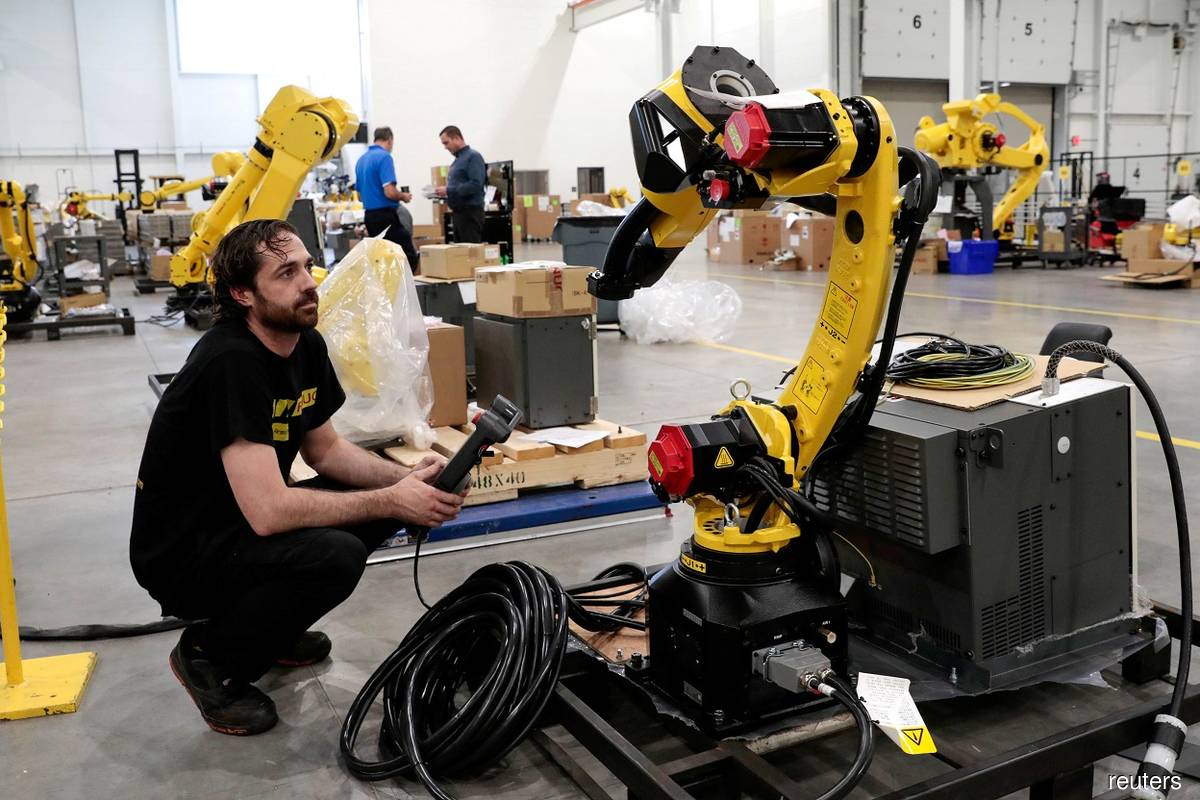 Robots marched on in 2021, with record orders by North American firms